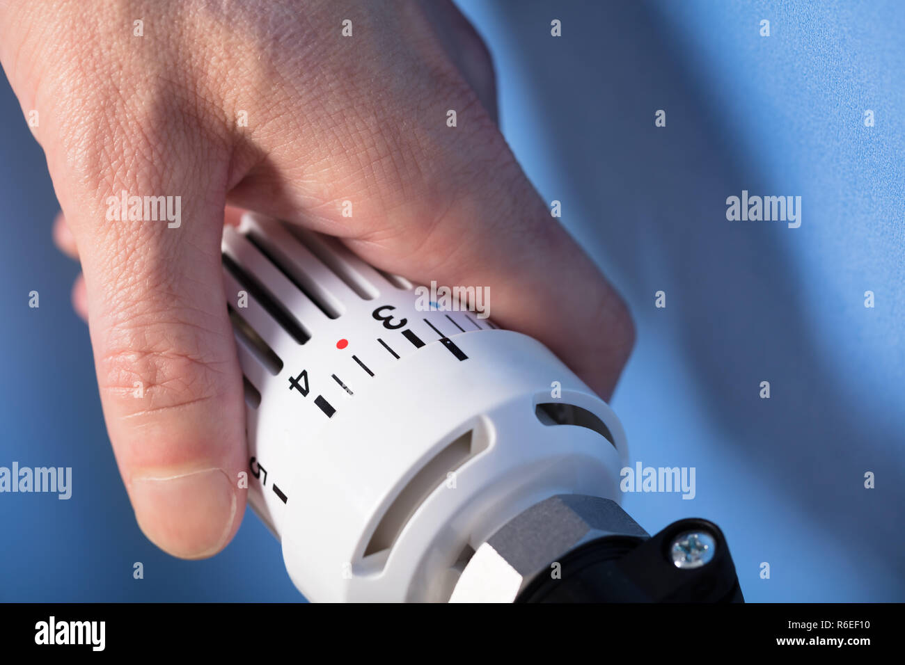 Person Adjusting Temperature Of Radiator Thermostat Stock Photo - Alamy