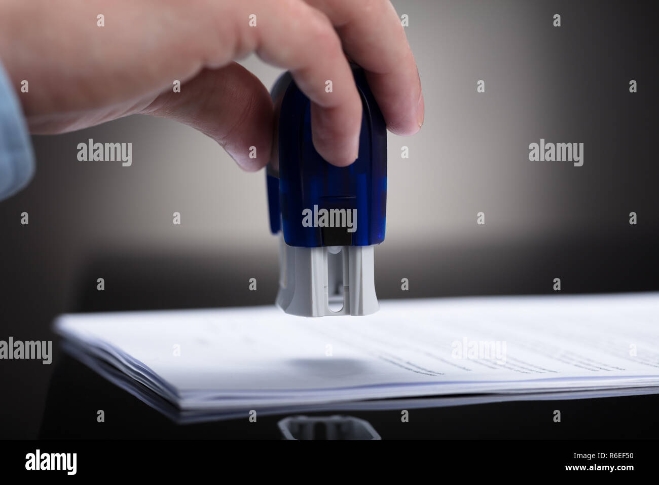 Businessperson Stamping On Approved Contract Form Stock Photo - Alamy