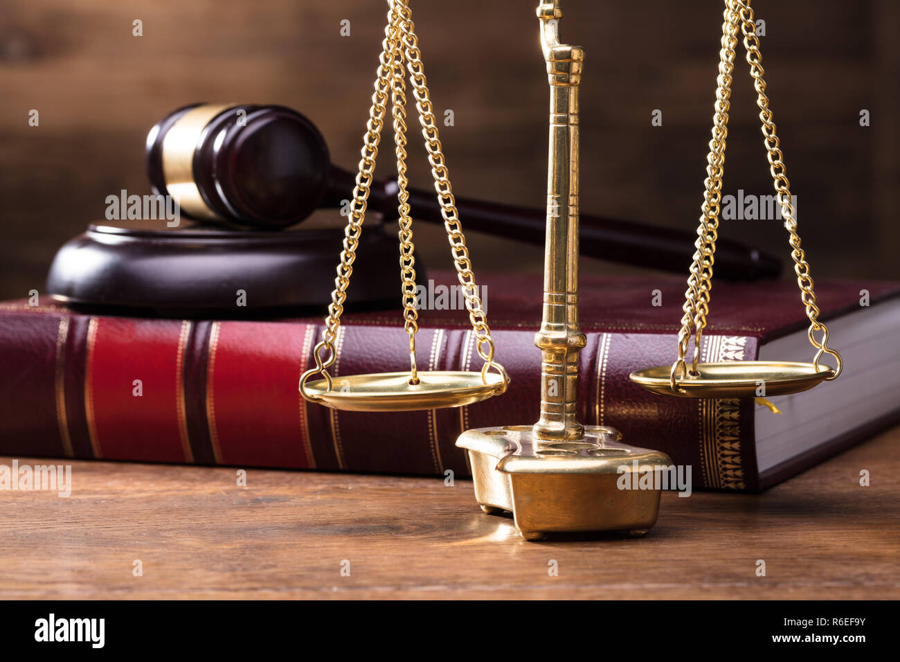 Judge Golden Scale In Front Of Gavel And Law Book Stock Photo - Alamy