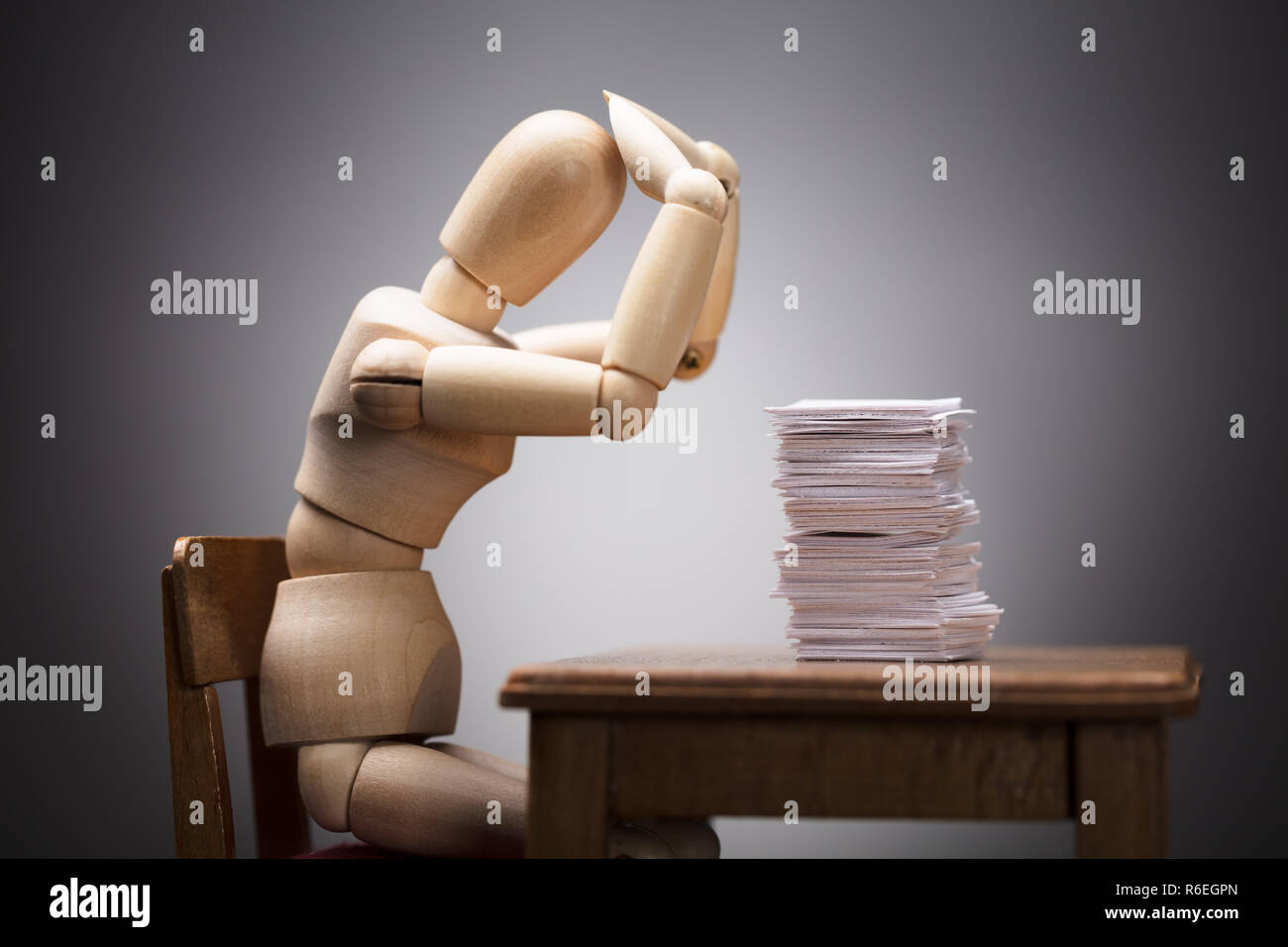 Wooden Dummy Figure Suffering From Headache Sitting On Chair Stock ...