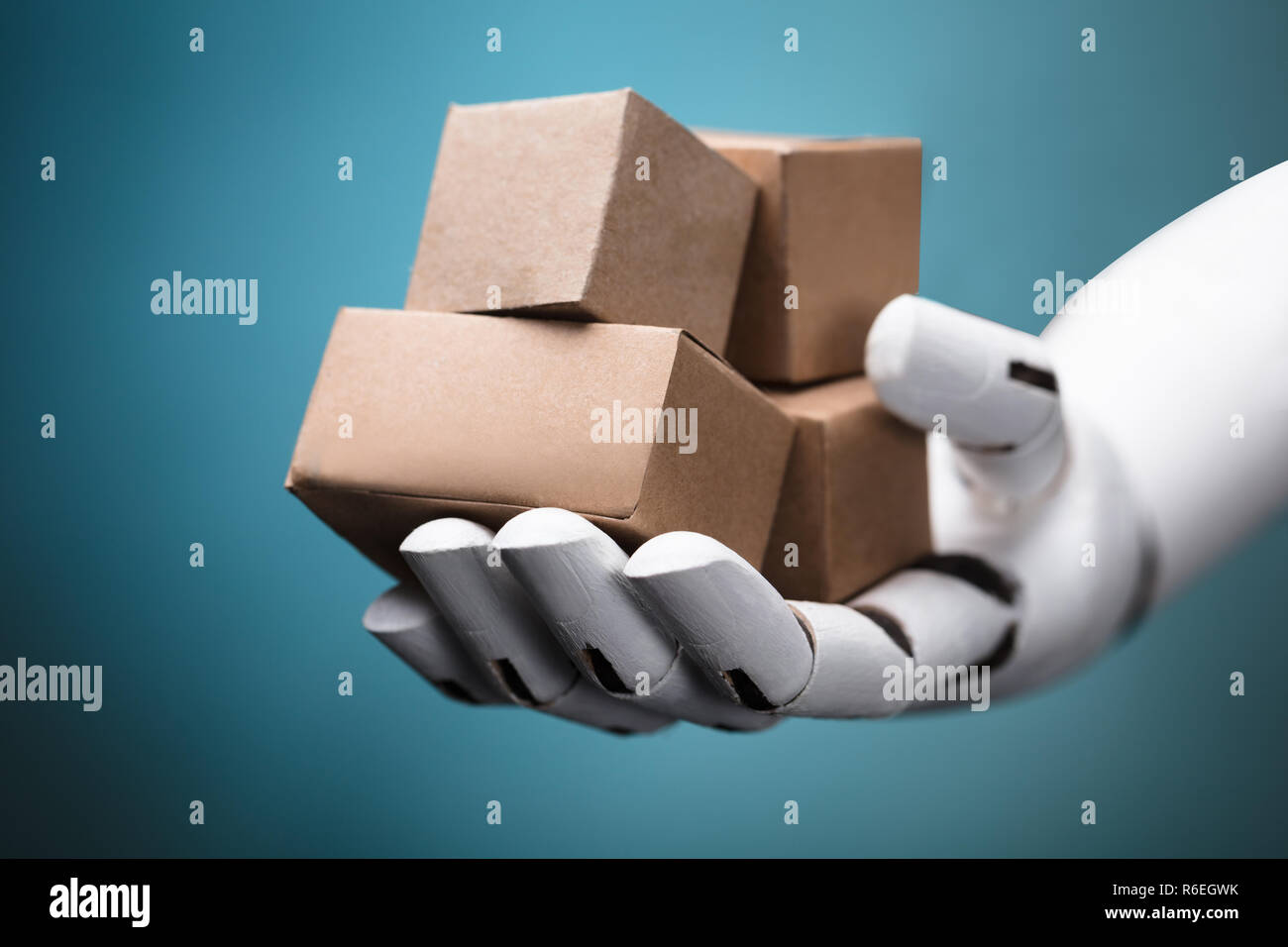 Robot Holding Cardboard Boxes Stock Photo - Alamy