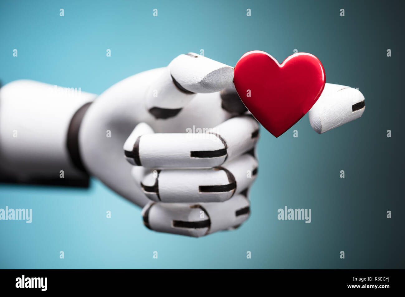 Robot Holding Red Heart Stock Photo - Alamy