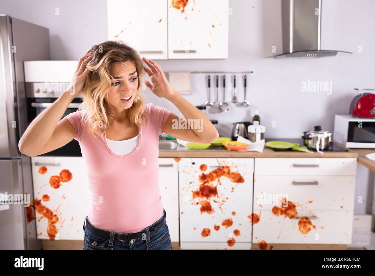 Woman mess kitchen upset hi-res stock photography and images - Alamy