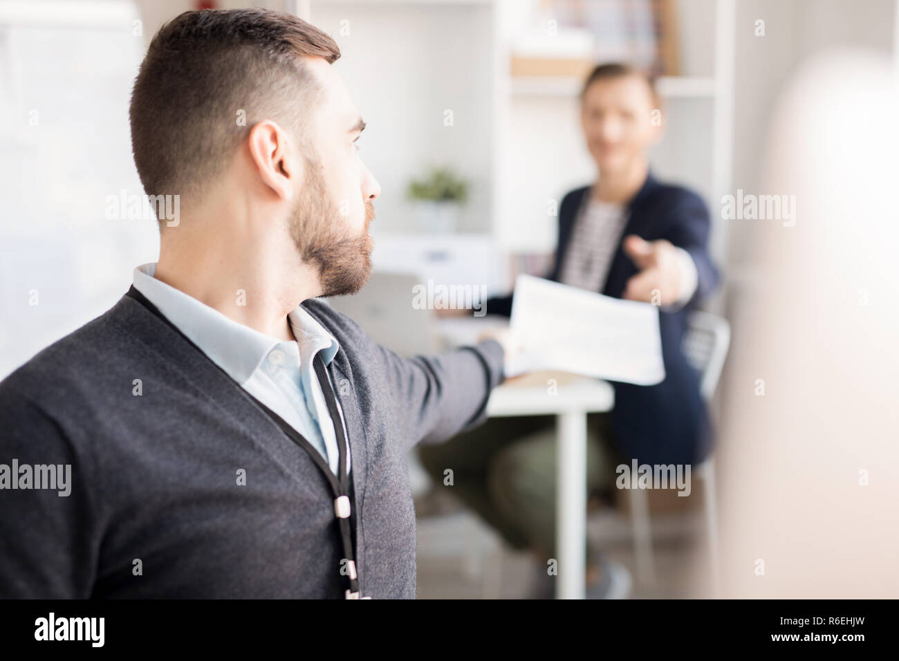 Handing holding hi-res stock photography and images - Alamy