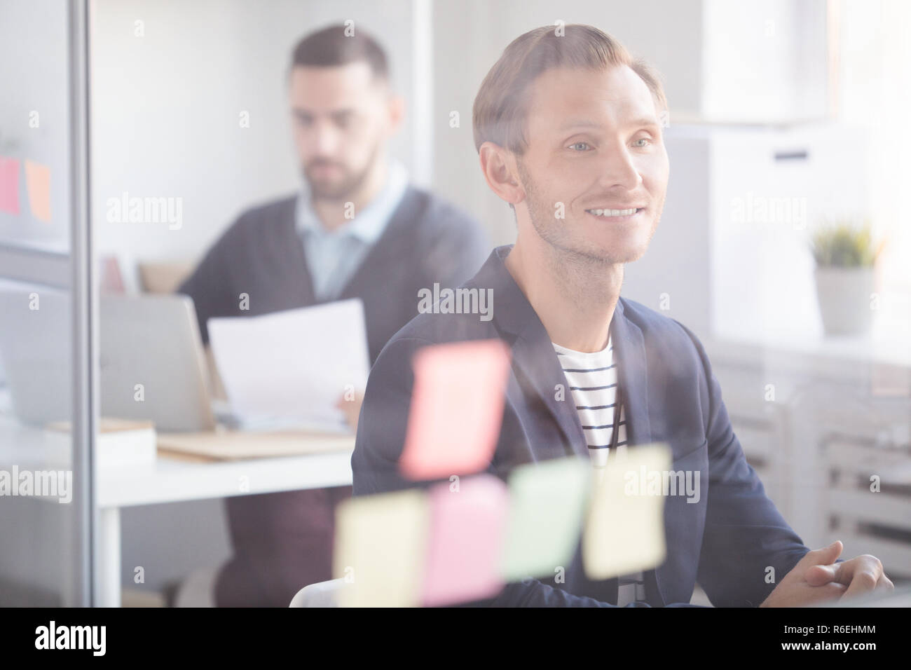 Smiling Office Worker in Cubicle Stock Photo - Alamy