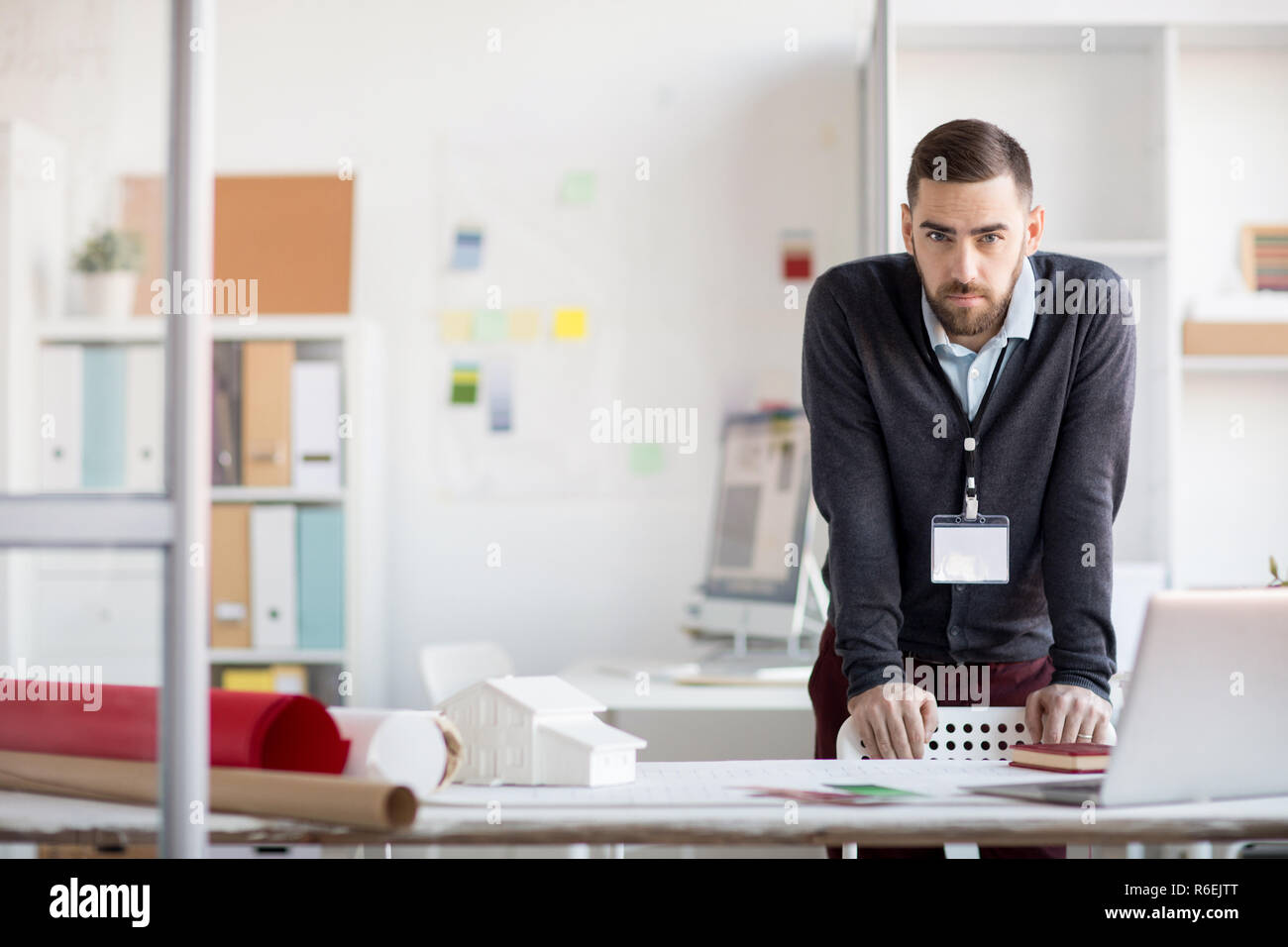 Serious Office Worker Looking at Camera Stock Photo - Alamy