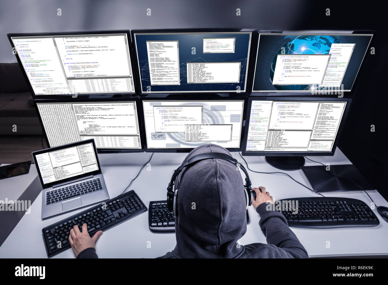 Hacker Stealing Information From Multiple Computers Stock Photo - Alamy