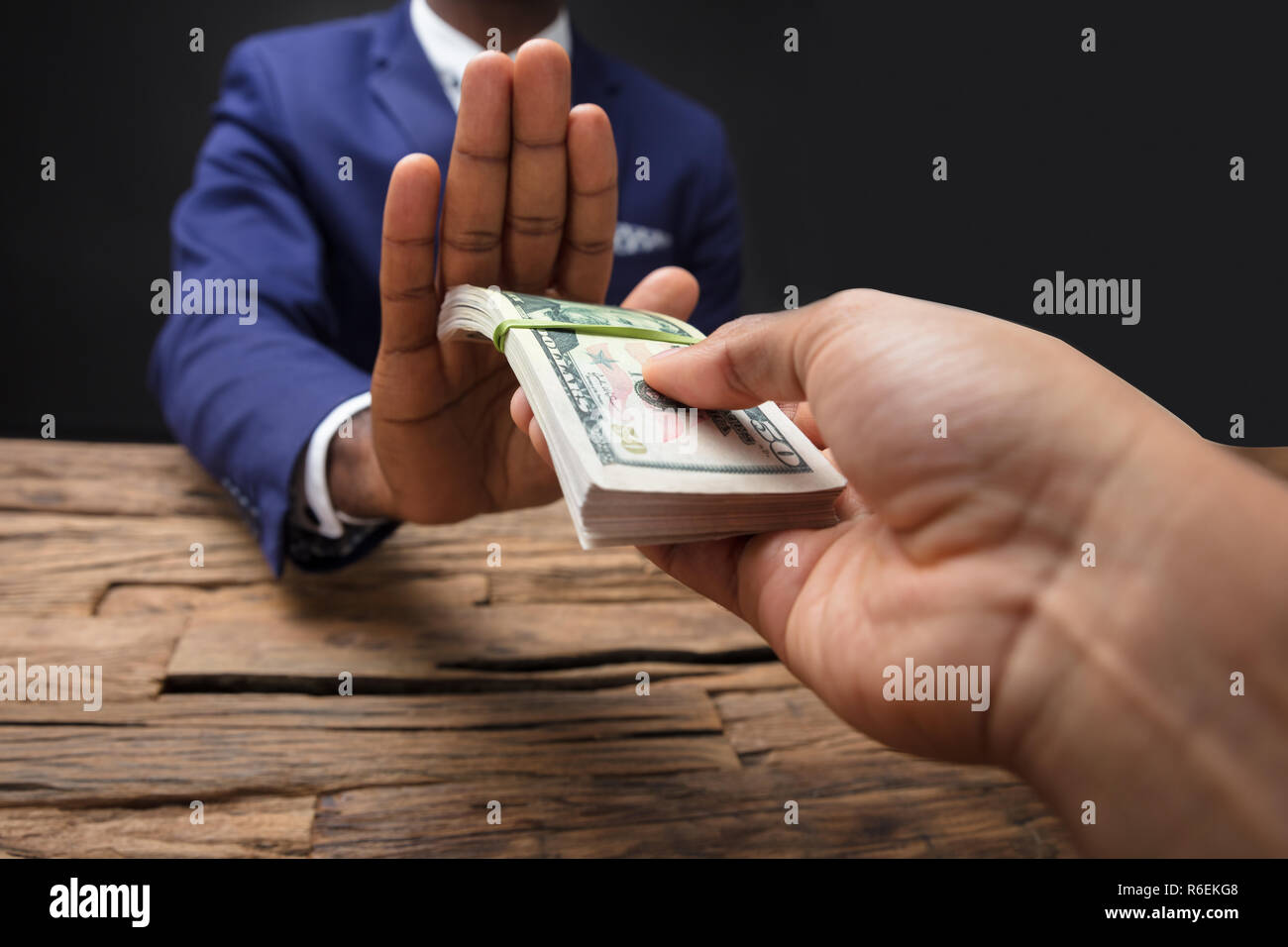 Businessman Refusing To Take Bribe From Partner Stock Photo - Alamy