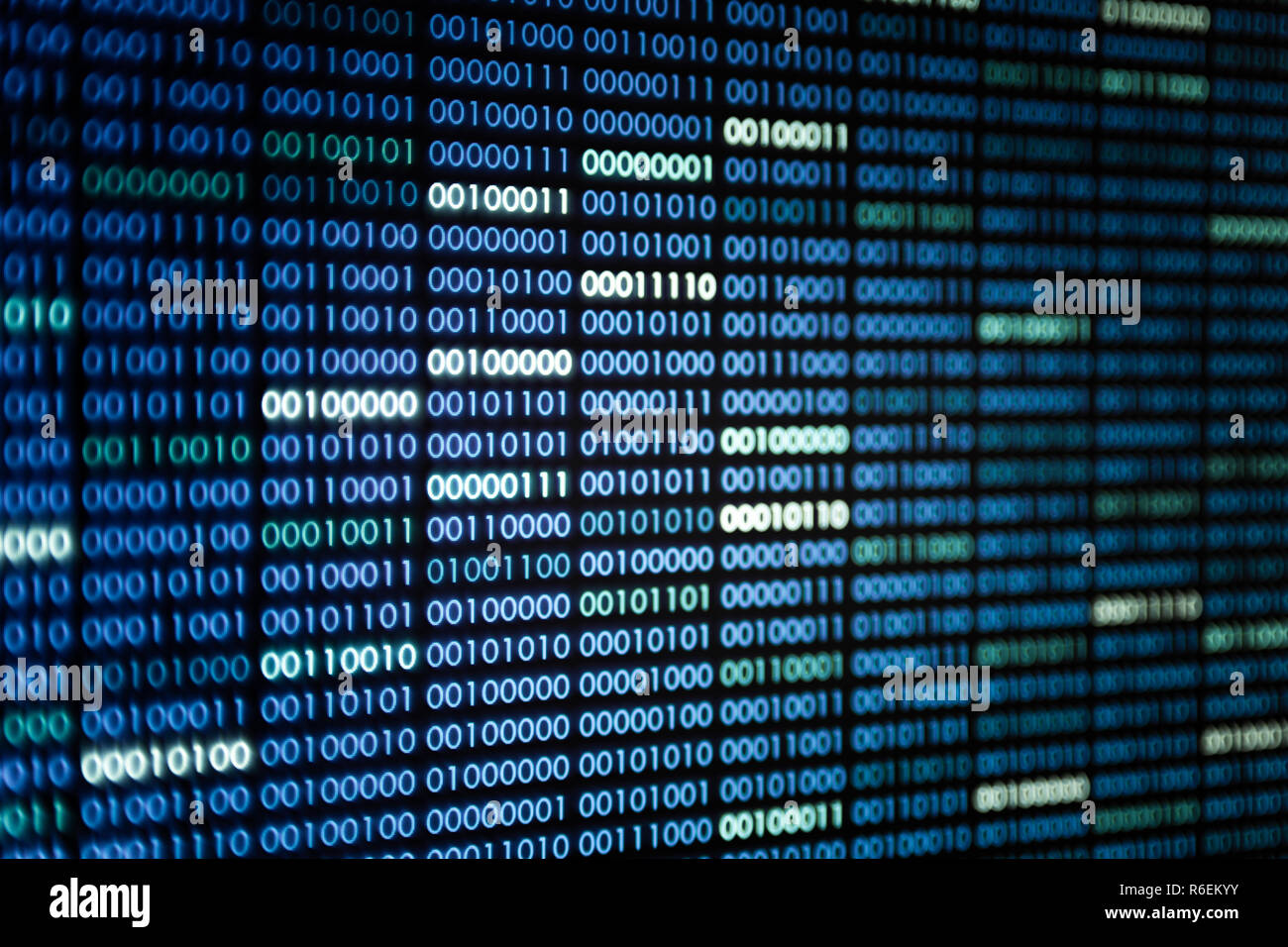 binary code on display screen. white blue light green colors number one ...