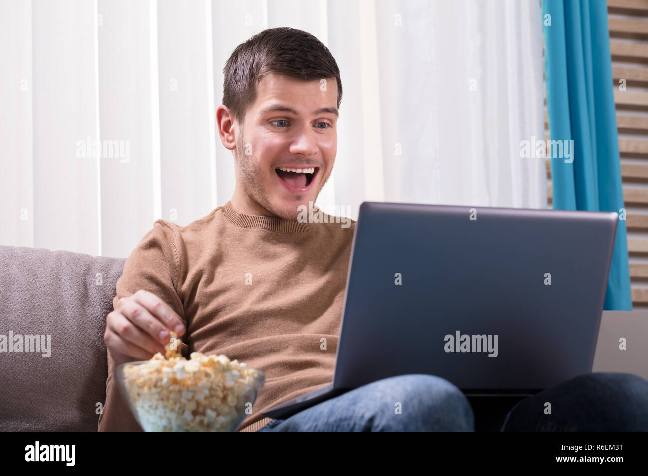 Watch movies on computer hi-res stock photography and images - Alamy