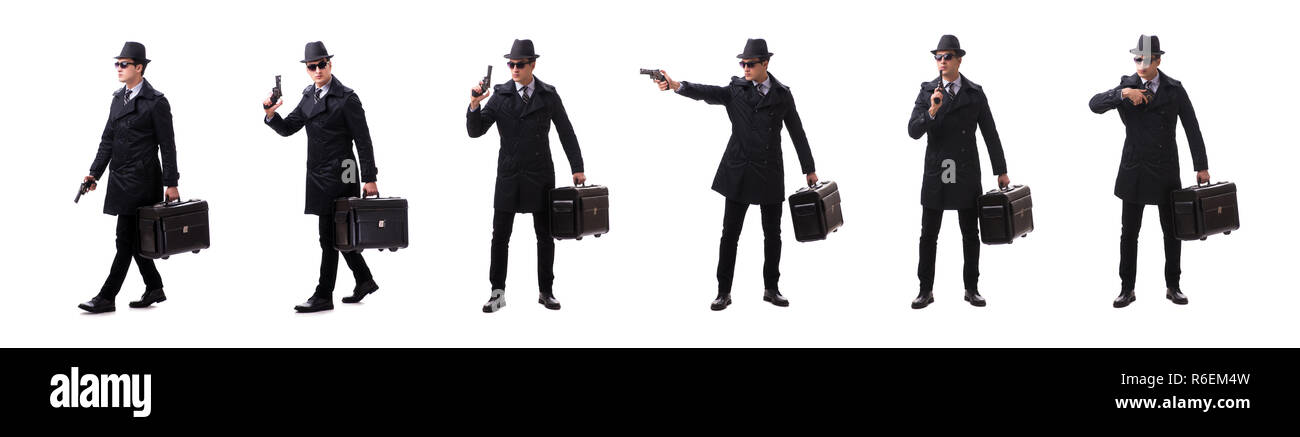 Man spy with handgun isolated on white background Stock Photo - Alamy