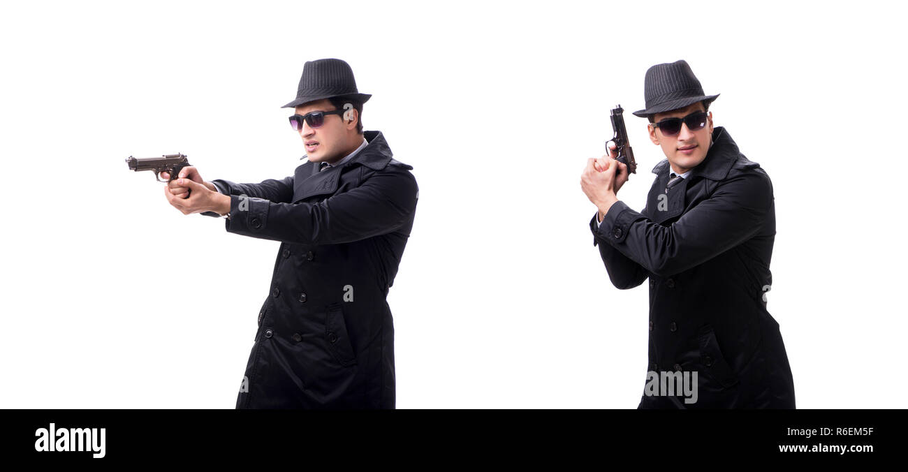 Man spy with handgun isolated on white background Stock Photo - Alamy