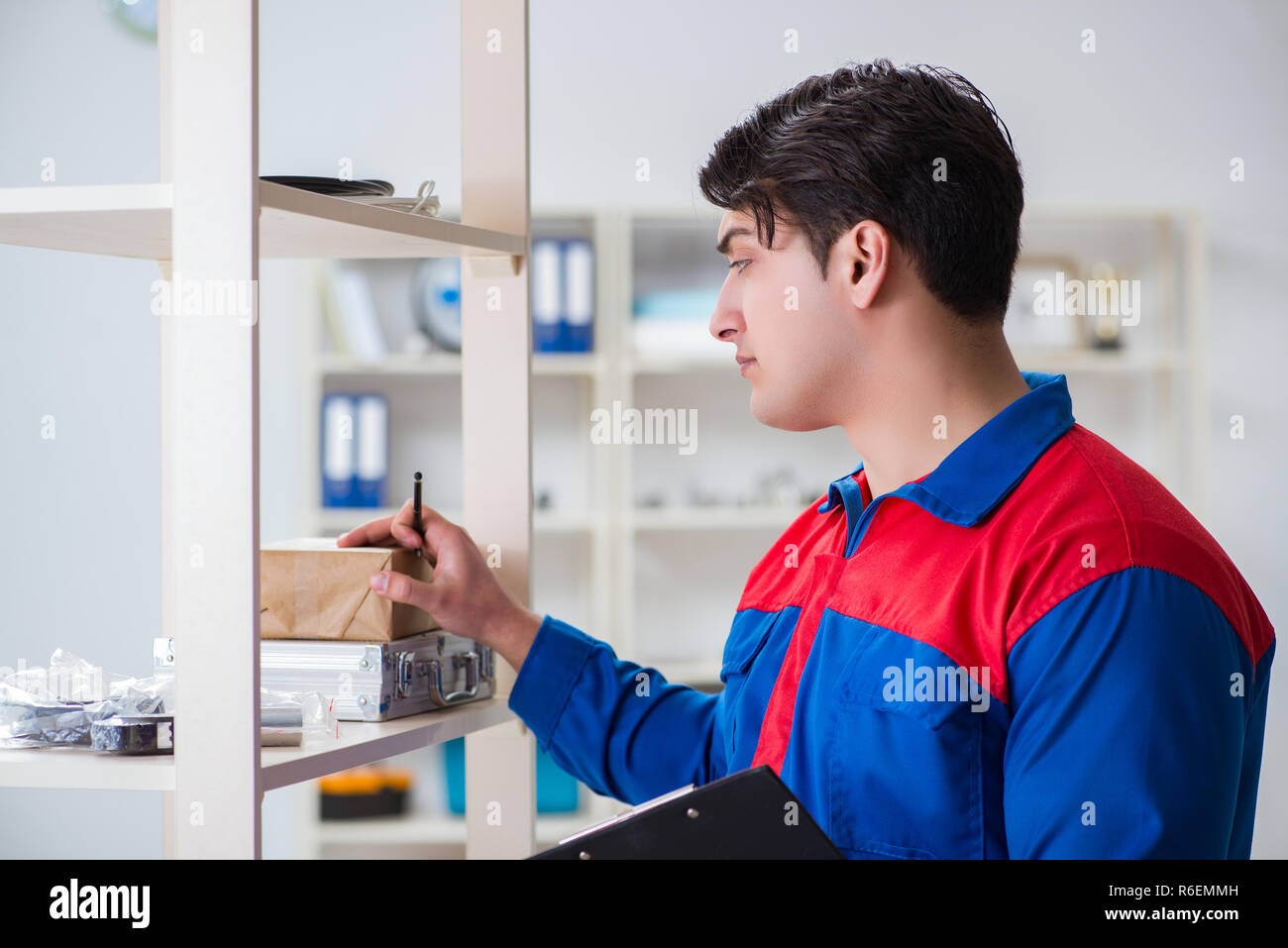 Man working in the postal warehouse Stock Photo - Alamy
