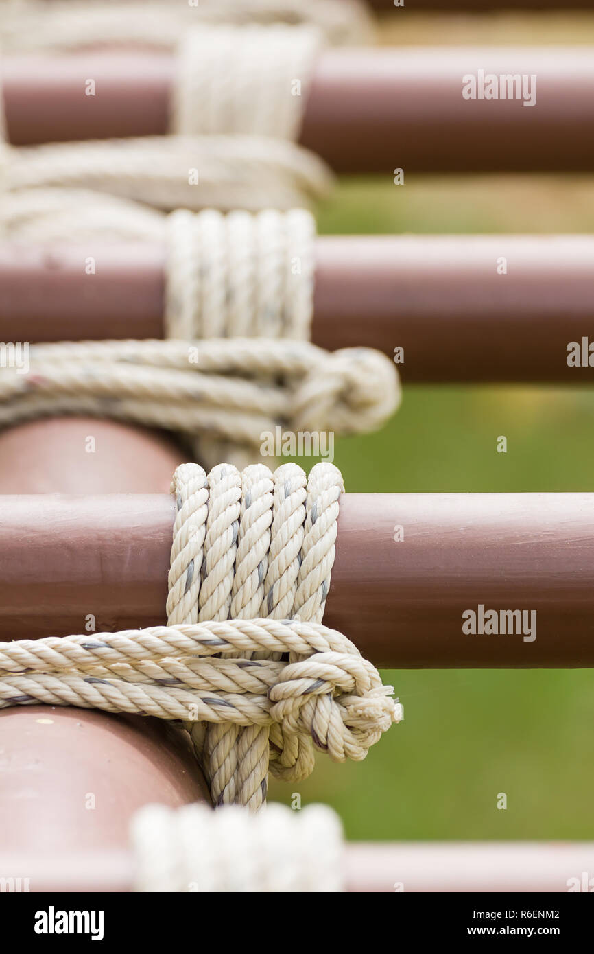 Rope knot around metal pipe Stock Photo - Alamy
