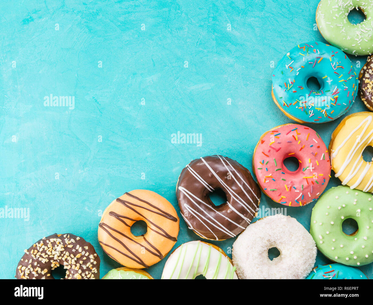 donuts on blue background , copy space, top view Stock Photo - Alamy