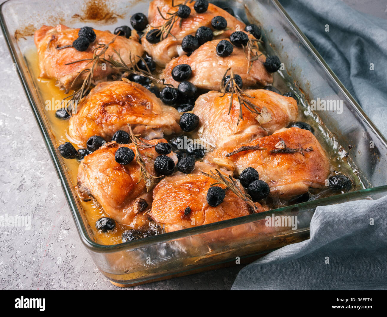 Corsican chicken thighs with rosemary and black olives Stock Photo - Alamy