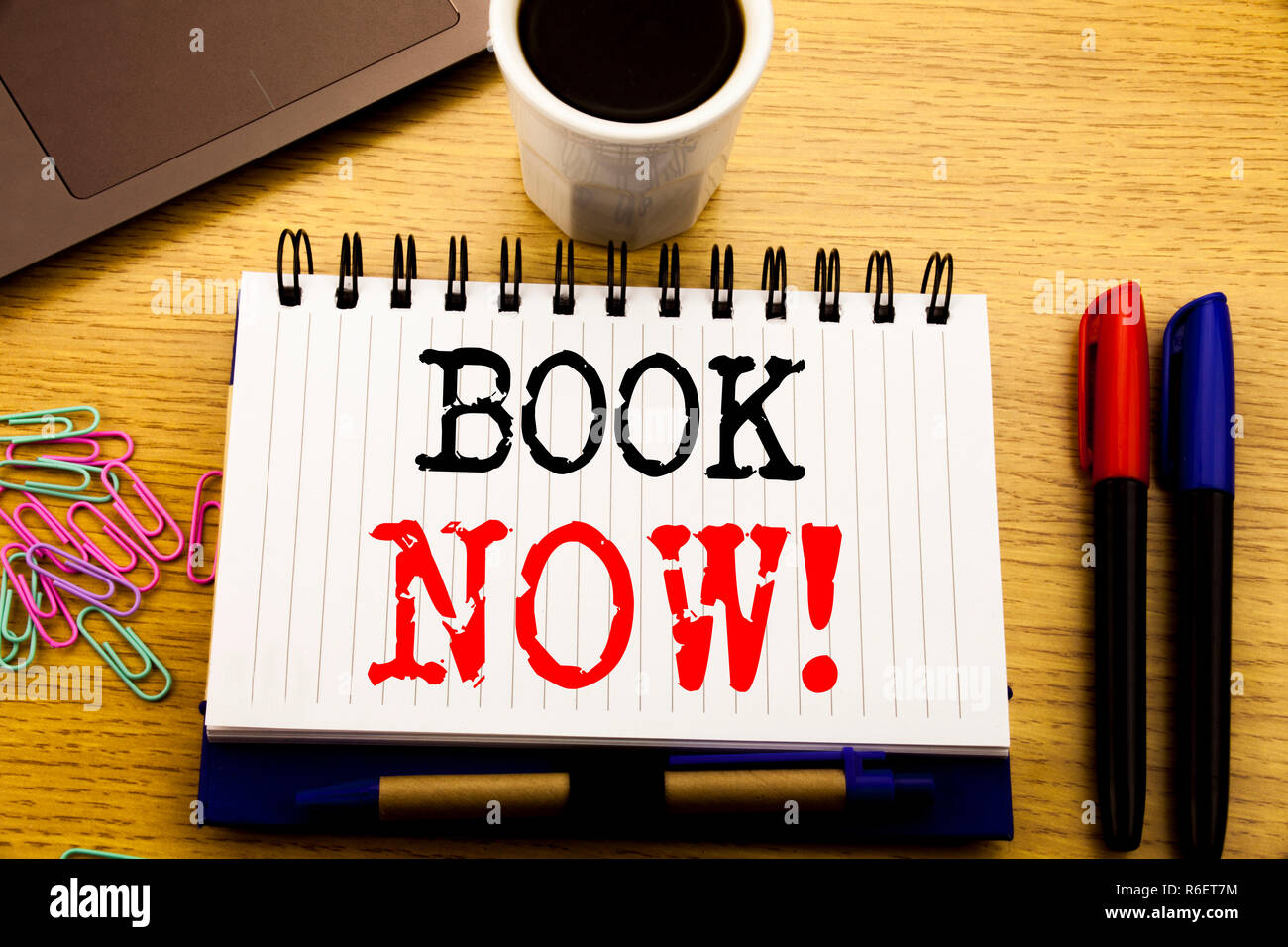 Hand writing text caption showing Book Now. Business concept for ...