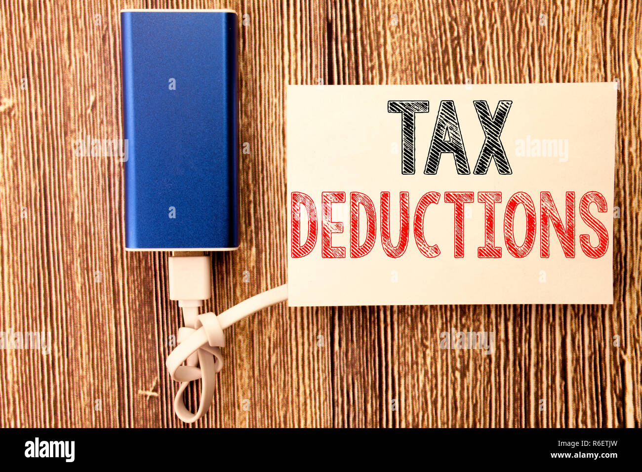 Conceptual hand writing text caption inspiration showing Tax Deductions ...