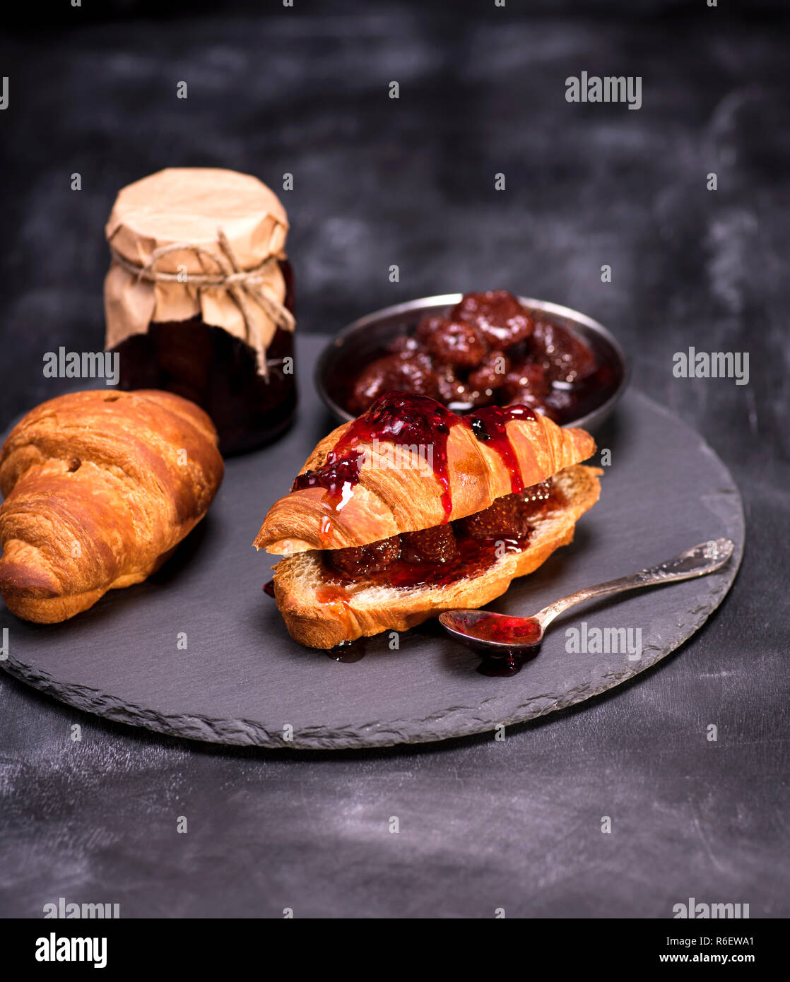 baked croissants and strawberry jam Stock Photo - Alamy