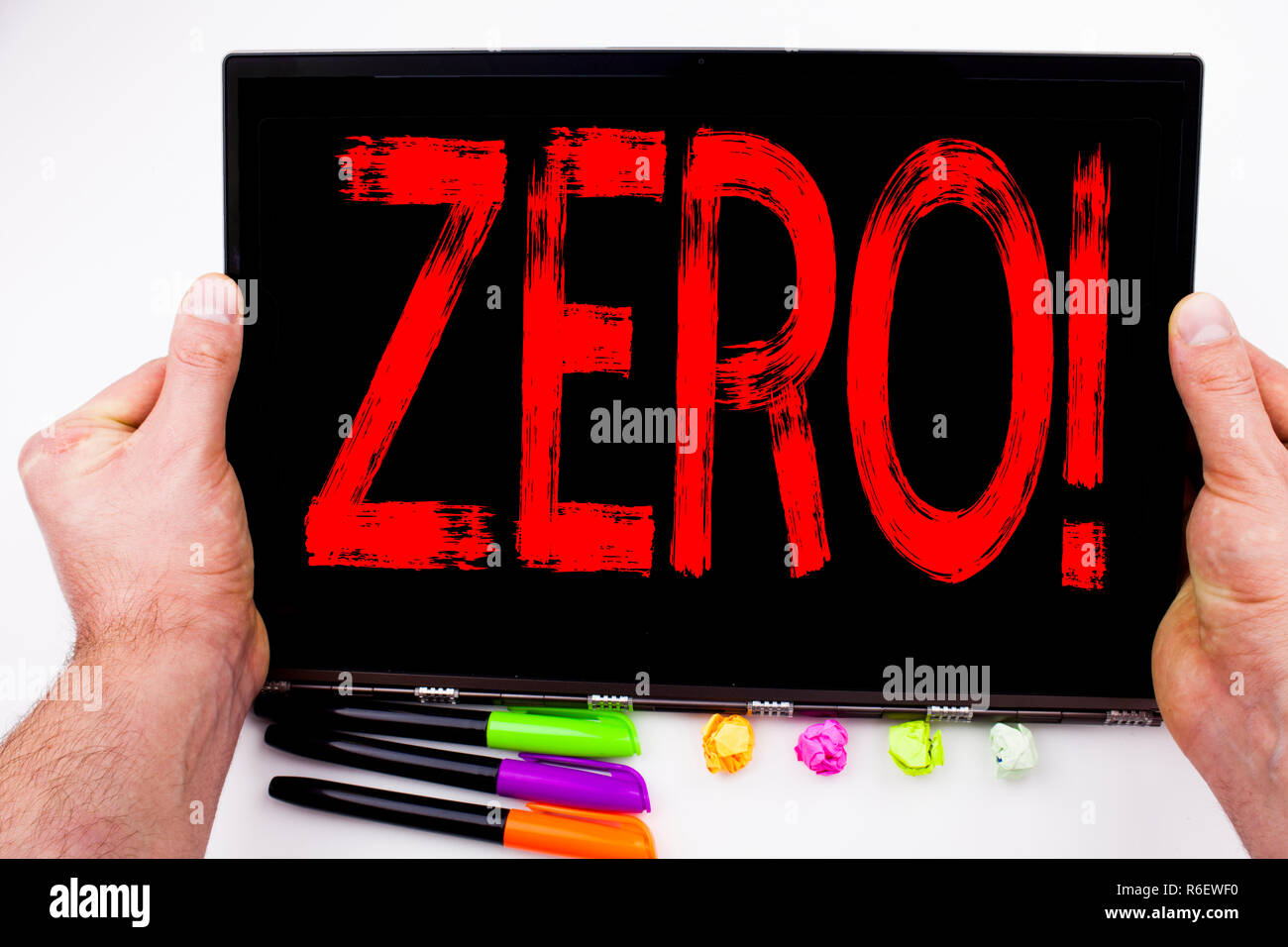 Zero text written on tablet, computer in the office with marker, pen ...