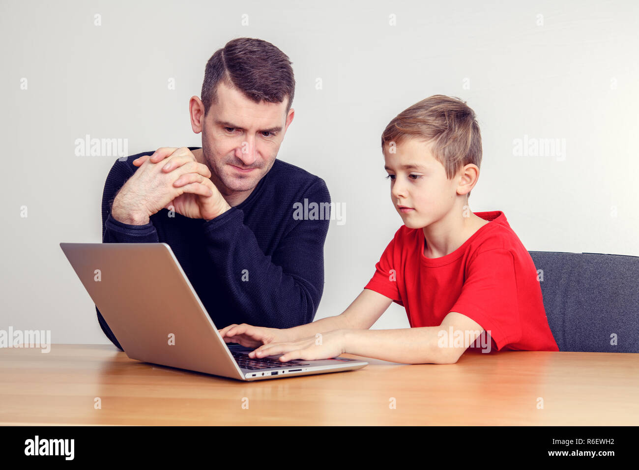 father and son using computer together Stock Photo - Alamy