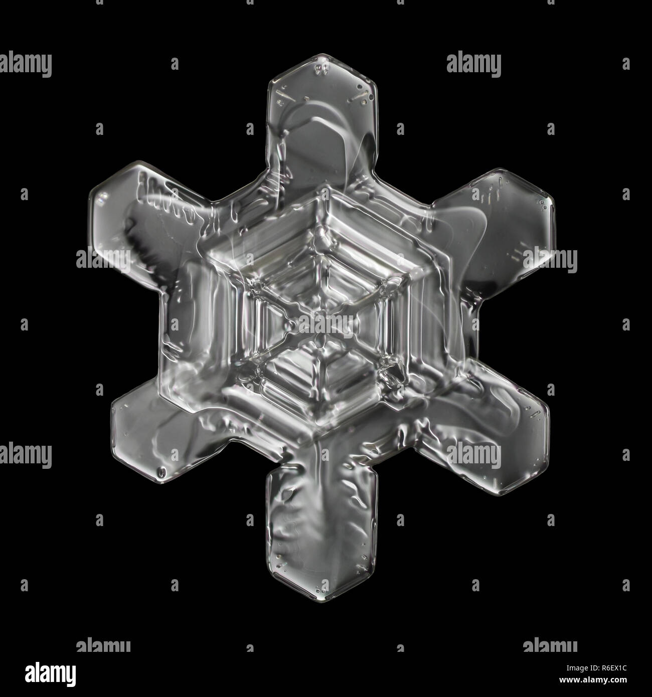 Extreme magnification - Real snowflake isolated on black background ...