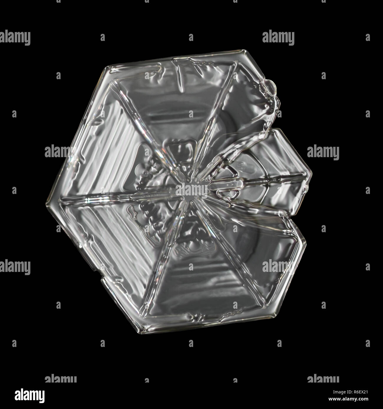 Extreme magnification - Real snowflake isolated on black background ...