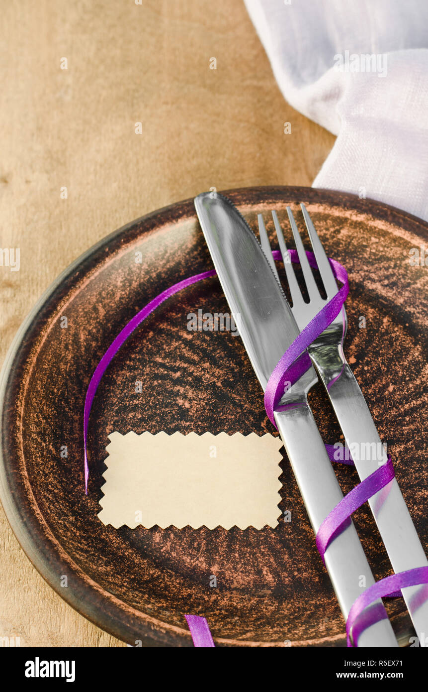Festive table setting with empty tag Stock Photo - Alamy