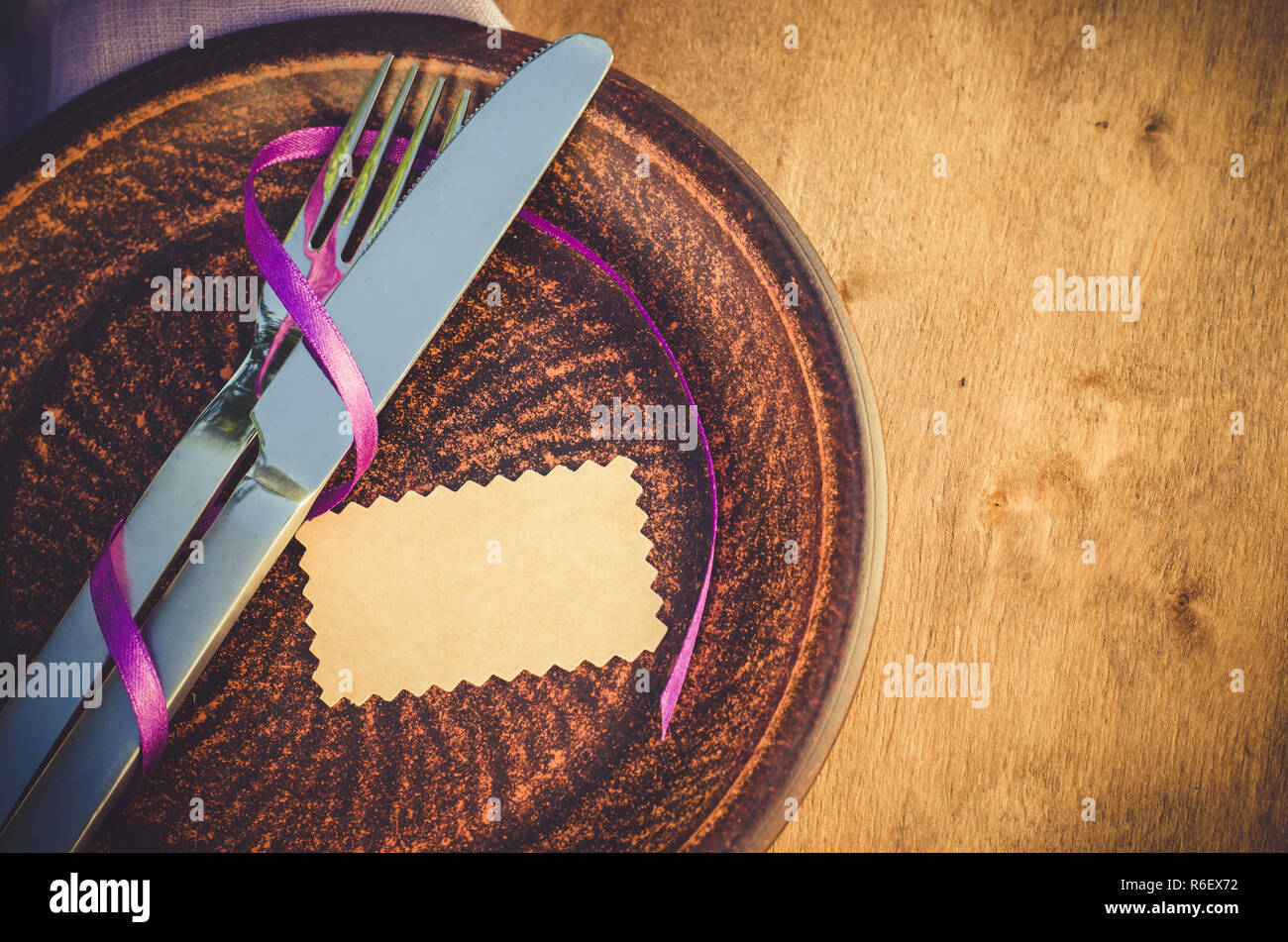 Festive table setting with empty tag Stock Photo - Alamy