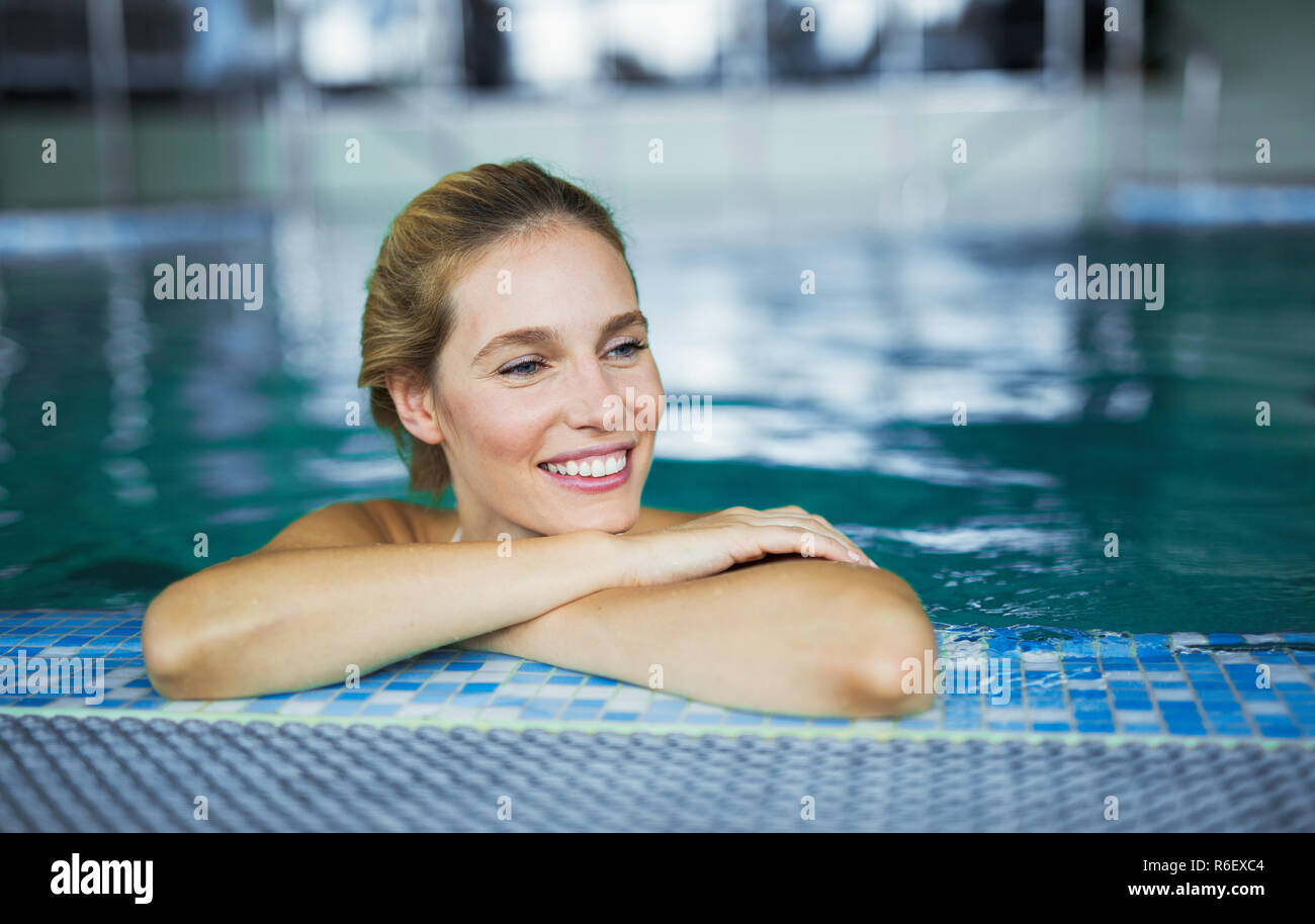Portrait of beautiful woman relaxing in swimming pool Stock Photo - Alamy