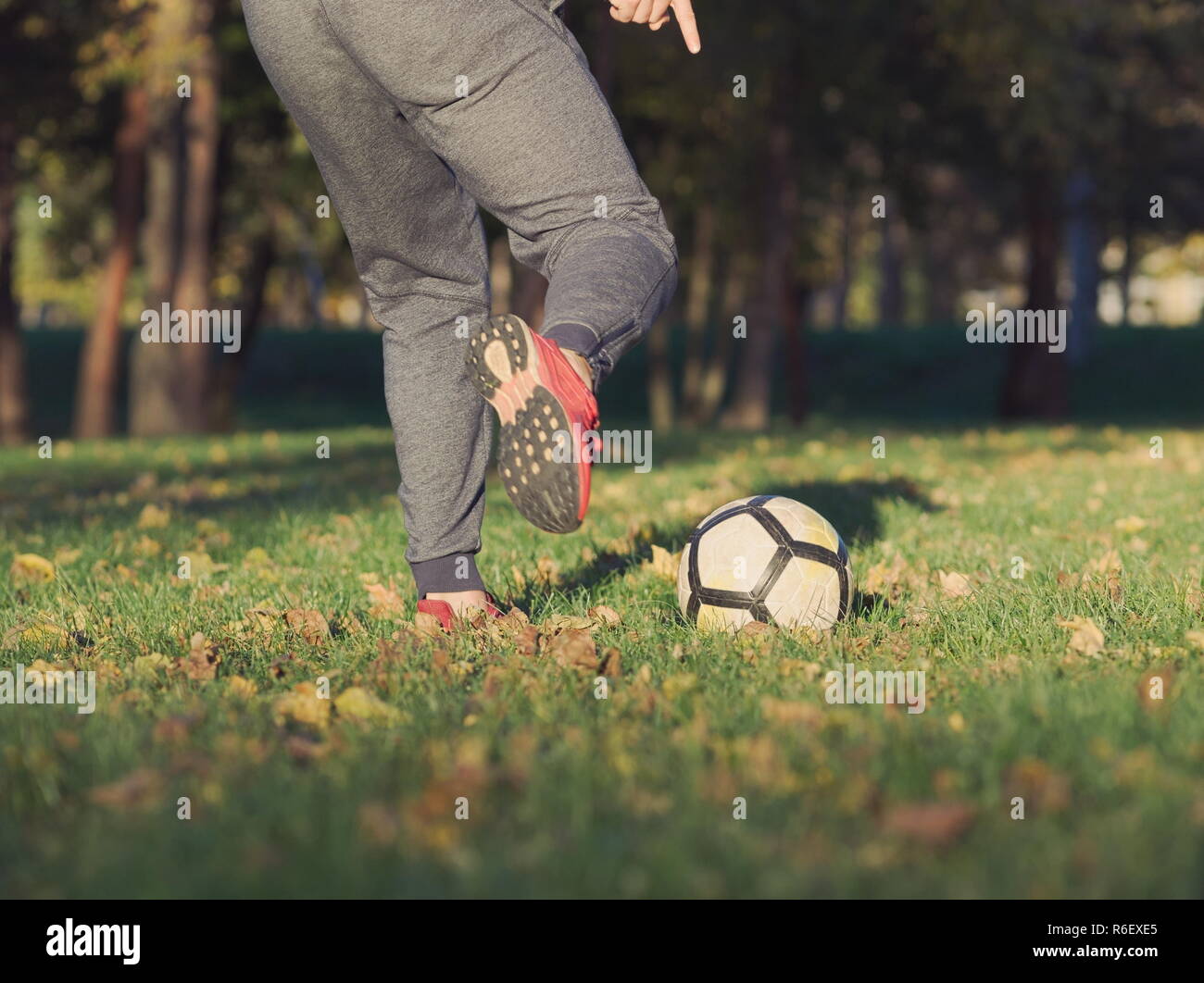 Man kicking ball hi-res stock photography and images - Alamy