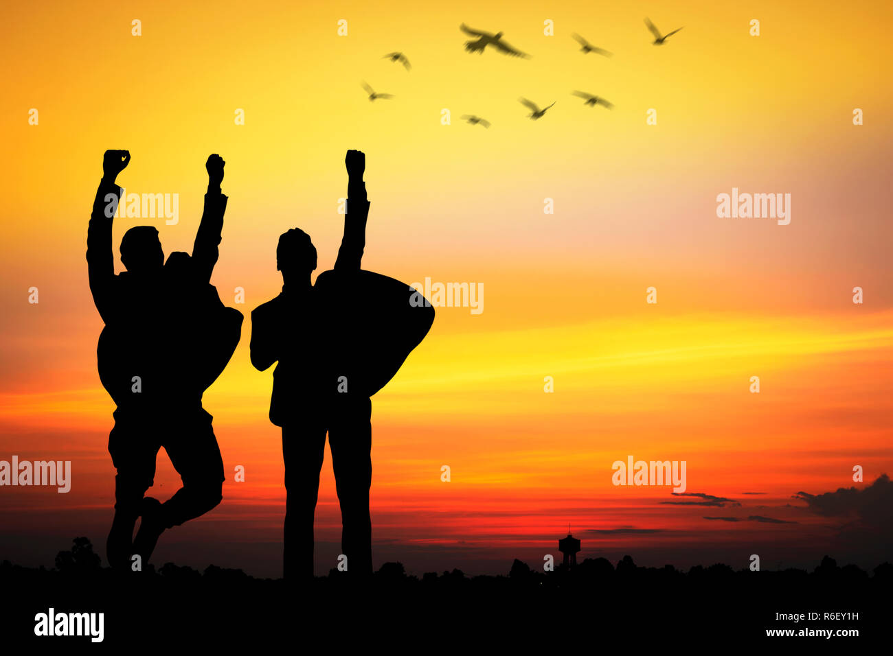 silhouette of business people jumping happily for success, freedom and ...