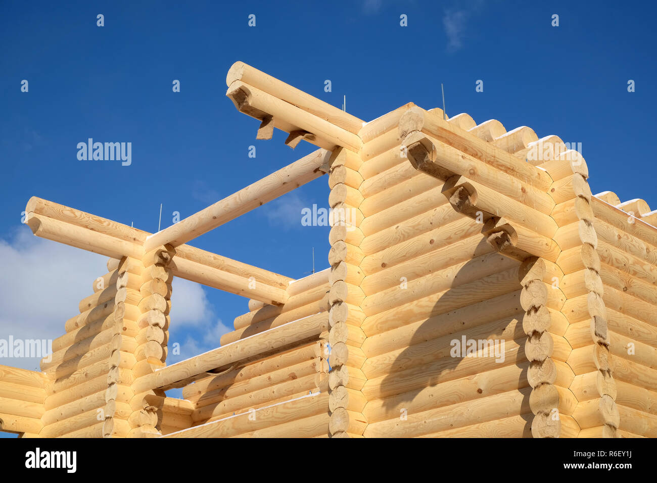 Big rural house construction from sandy brown smooth planed heavy pine ...