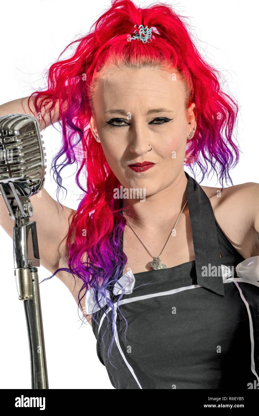 rock'n'roll singer with red hair and microphone Stock Photo - Alamy