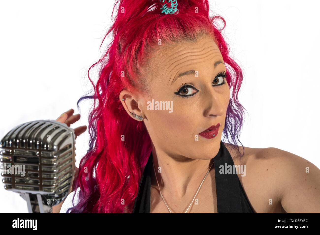 rock'n'roll singer with red hair and microphone Stock Photo - Alamy