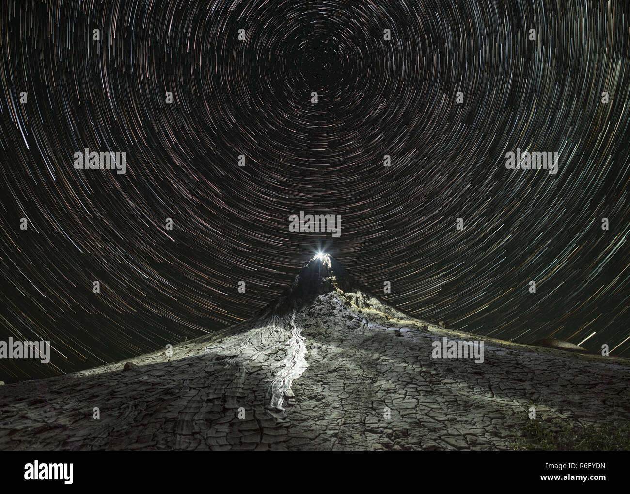 Star trails over the muddy volcano landscape in Romania Stock Photo - Alamy