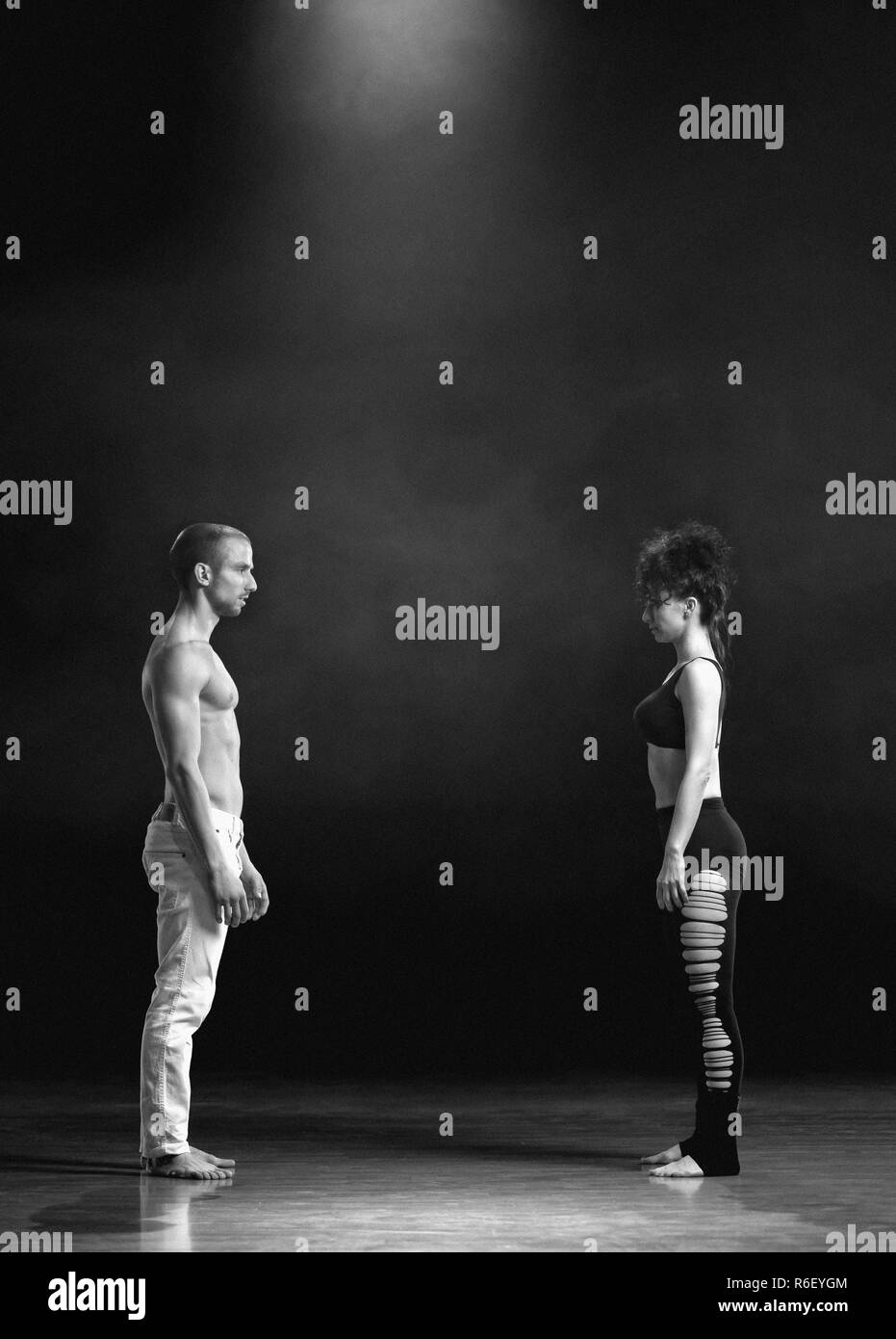 A man and a woman performing a contemporary dance pose on a stage Stock ...