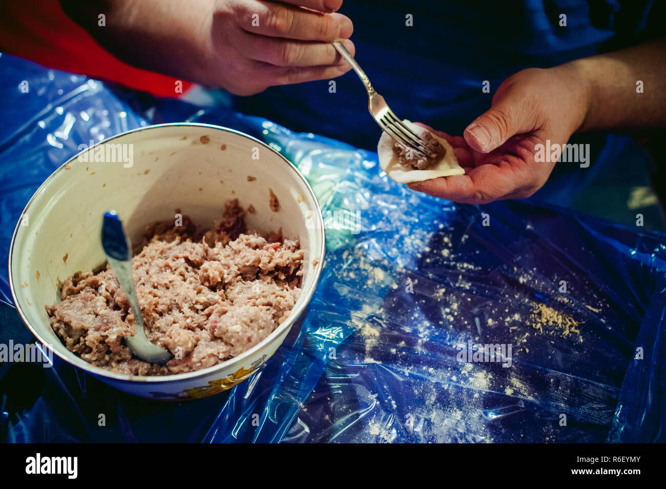 hand modeling dumplings at home in the kitchen Stock Photo - Alamy
