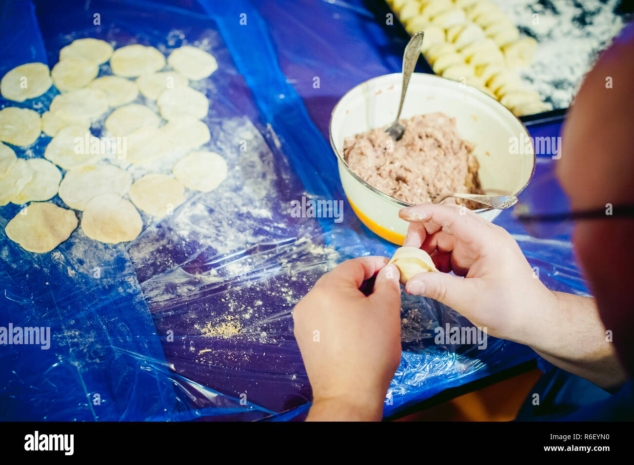 hand modeling dumplings at home in the kitchen Stock Photo - Alamy