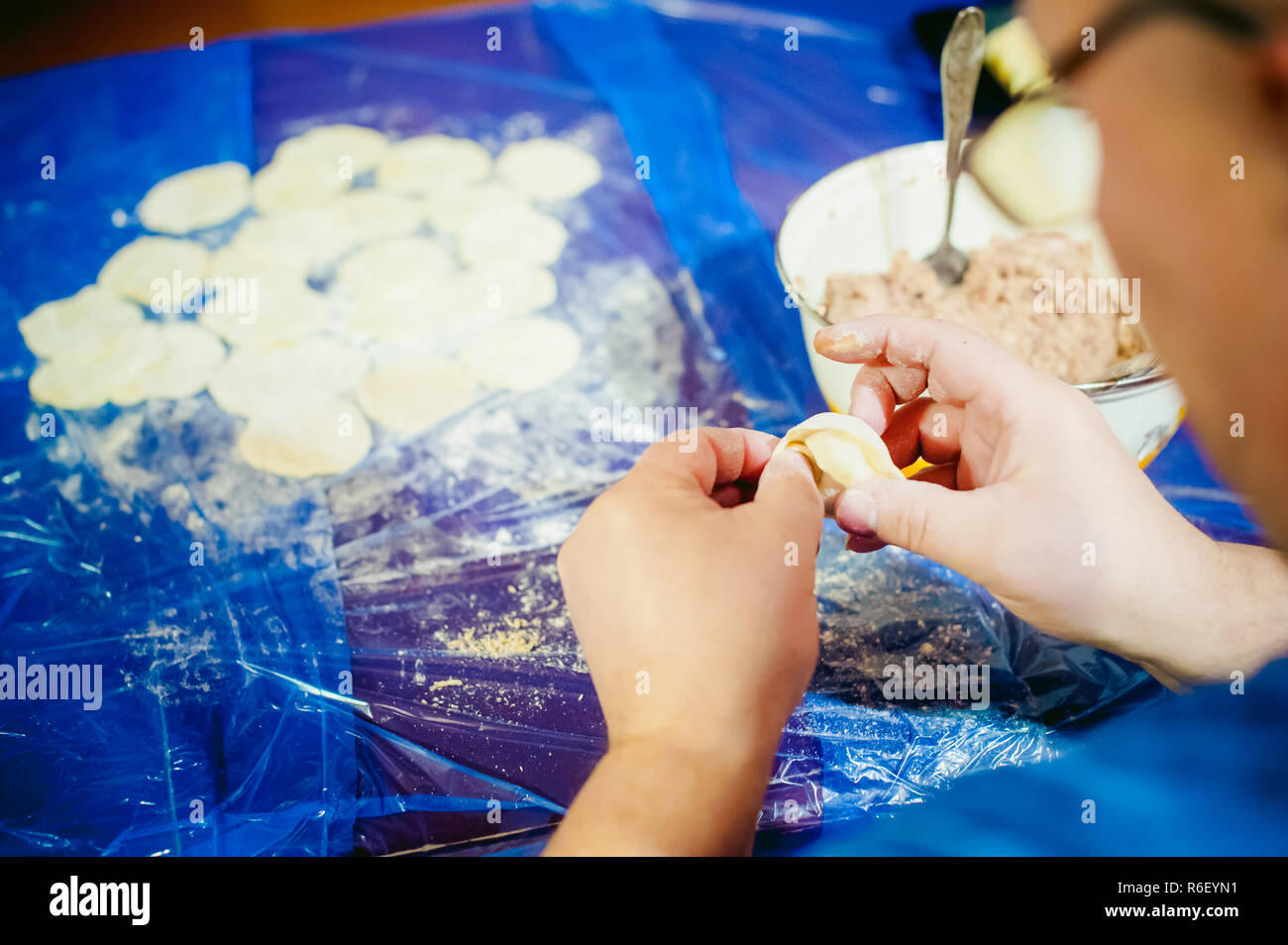 hand modeling dumplings at home in the kitchen Stock Photo - Alamy