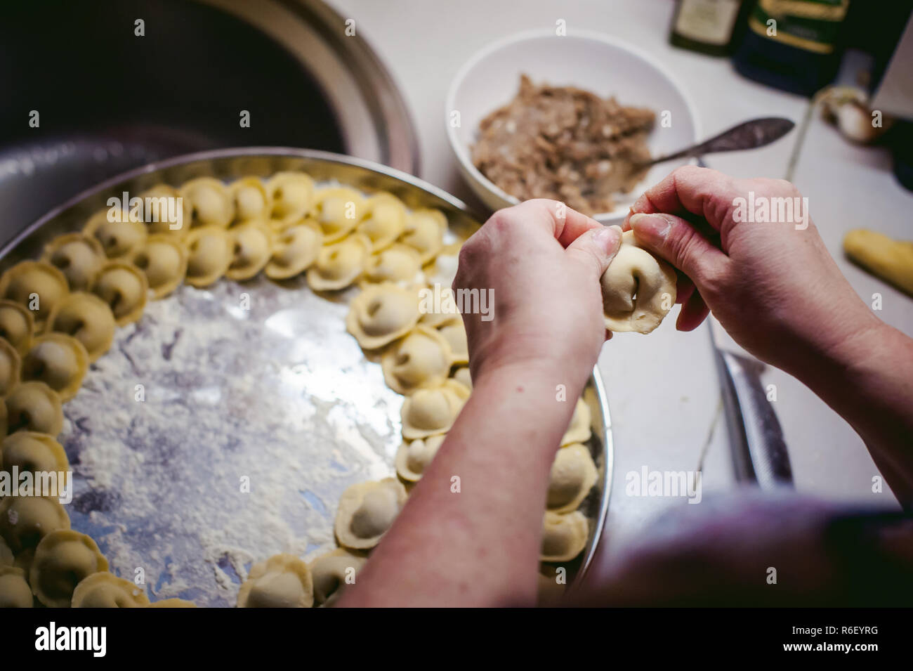 hand modeling dumplings at home in the kitchen Stock Photo - Alamy