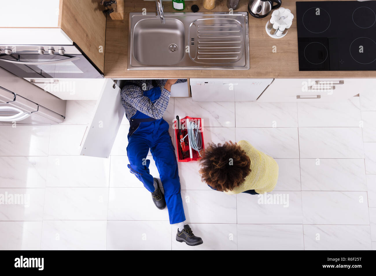 Plumbing Job Under Kitchen Sink High Resolution Stock Photography and ...