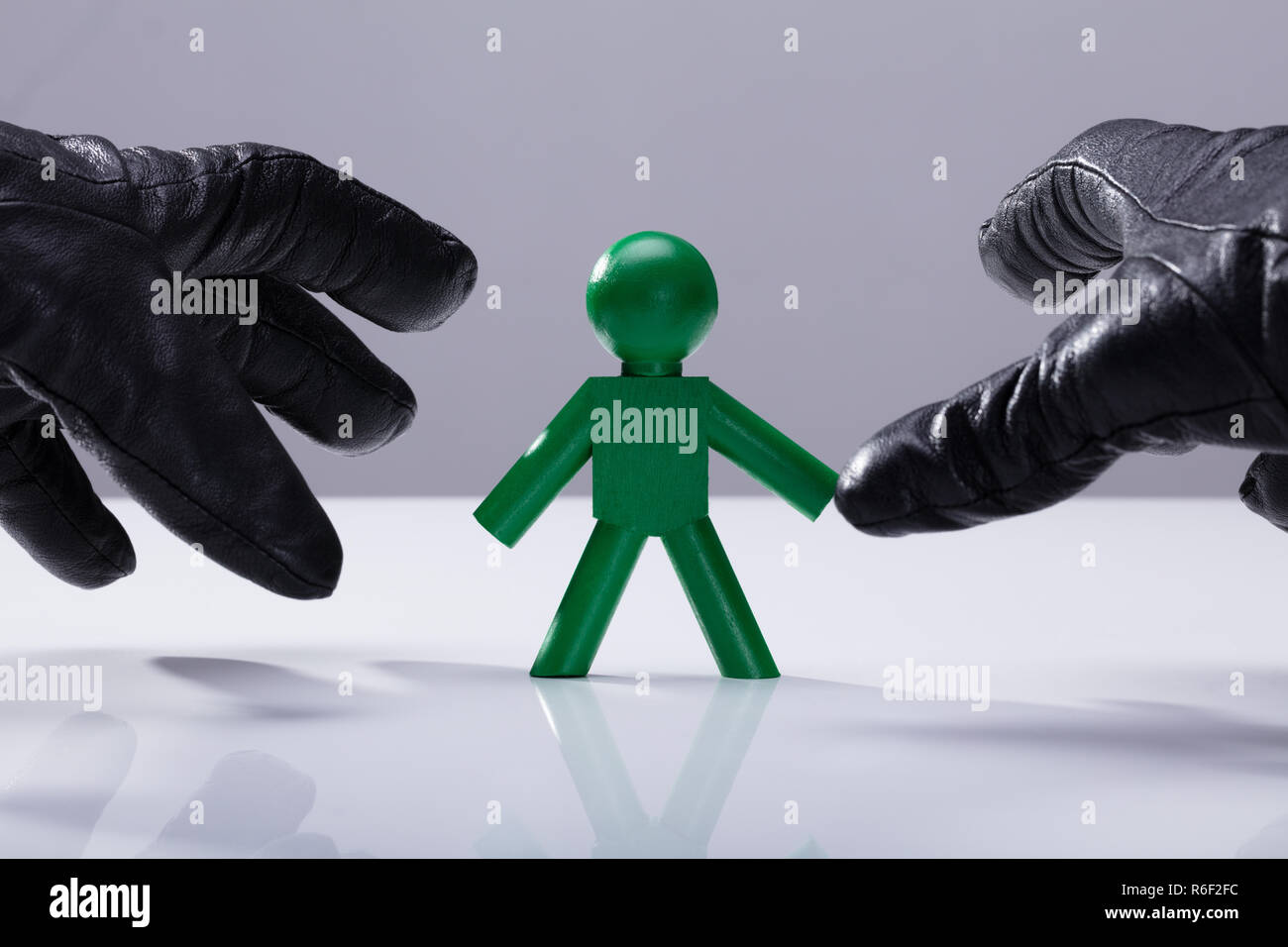 Thief Stealing Green Human Figure Stock Photo - Alamy