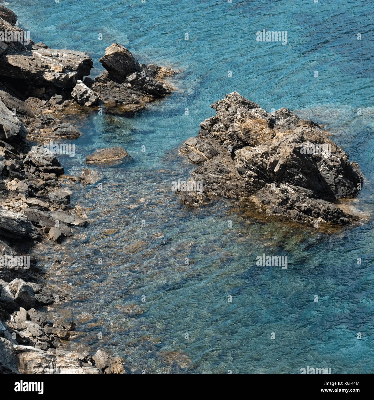 Mediterranean cliffs over a deep blue sea in summertime Stock Photo - Alamy