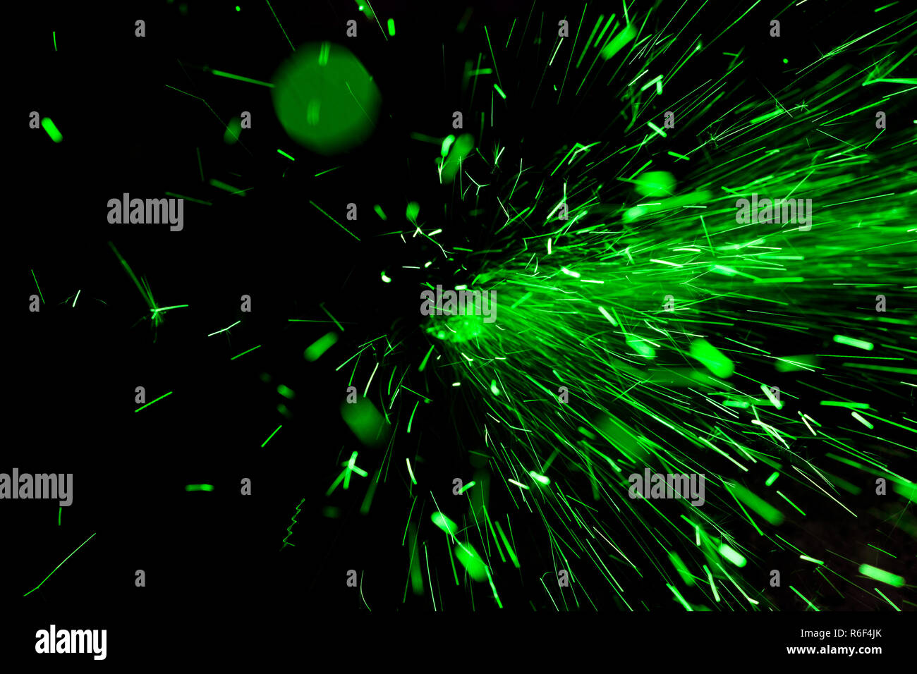 bright green sparks on black background Stock Photo - Alamy