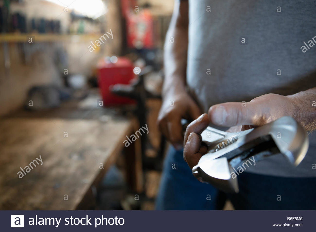 Person holding a wrench hi-res stock photography and images - Alamy