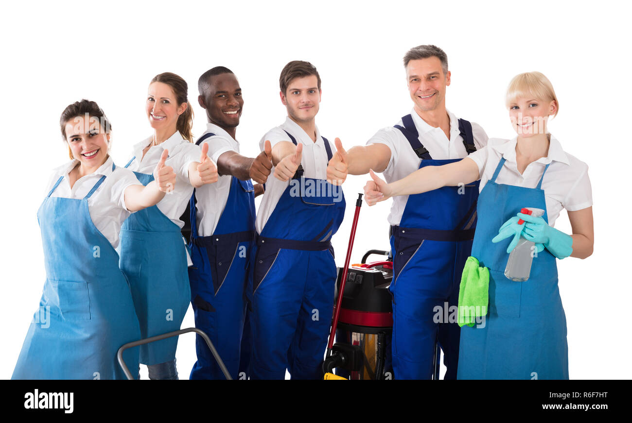 Portrait Of Janitors Gesturing Thumbs Up Stock Photo - Alamy