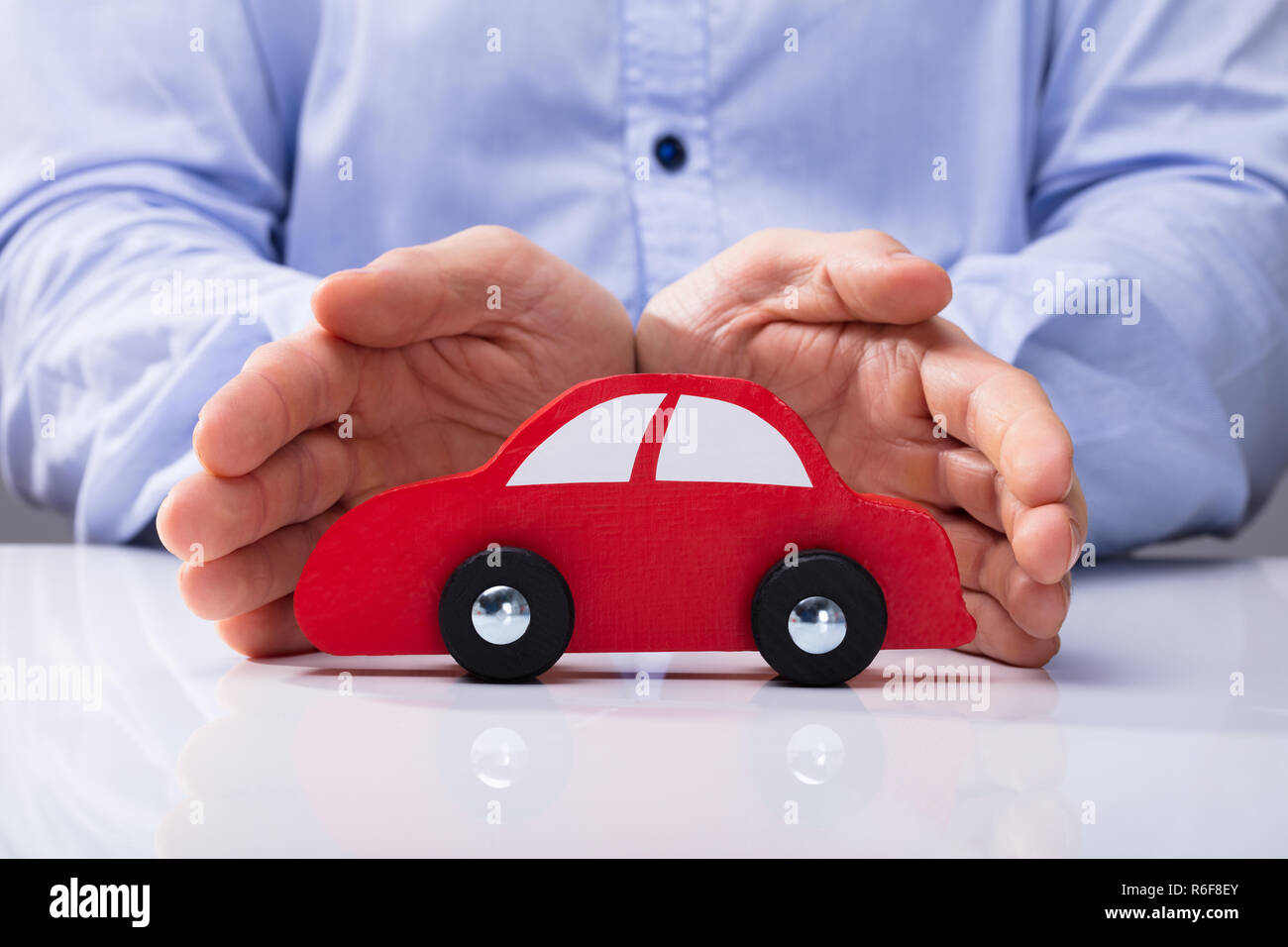 Person Protecting Red Car Stock Photo - Alamy