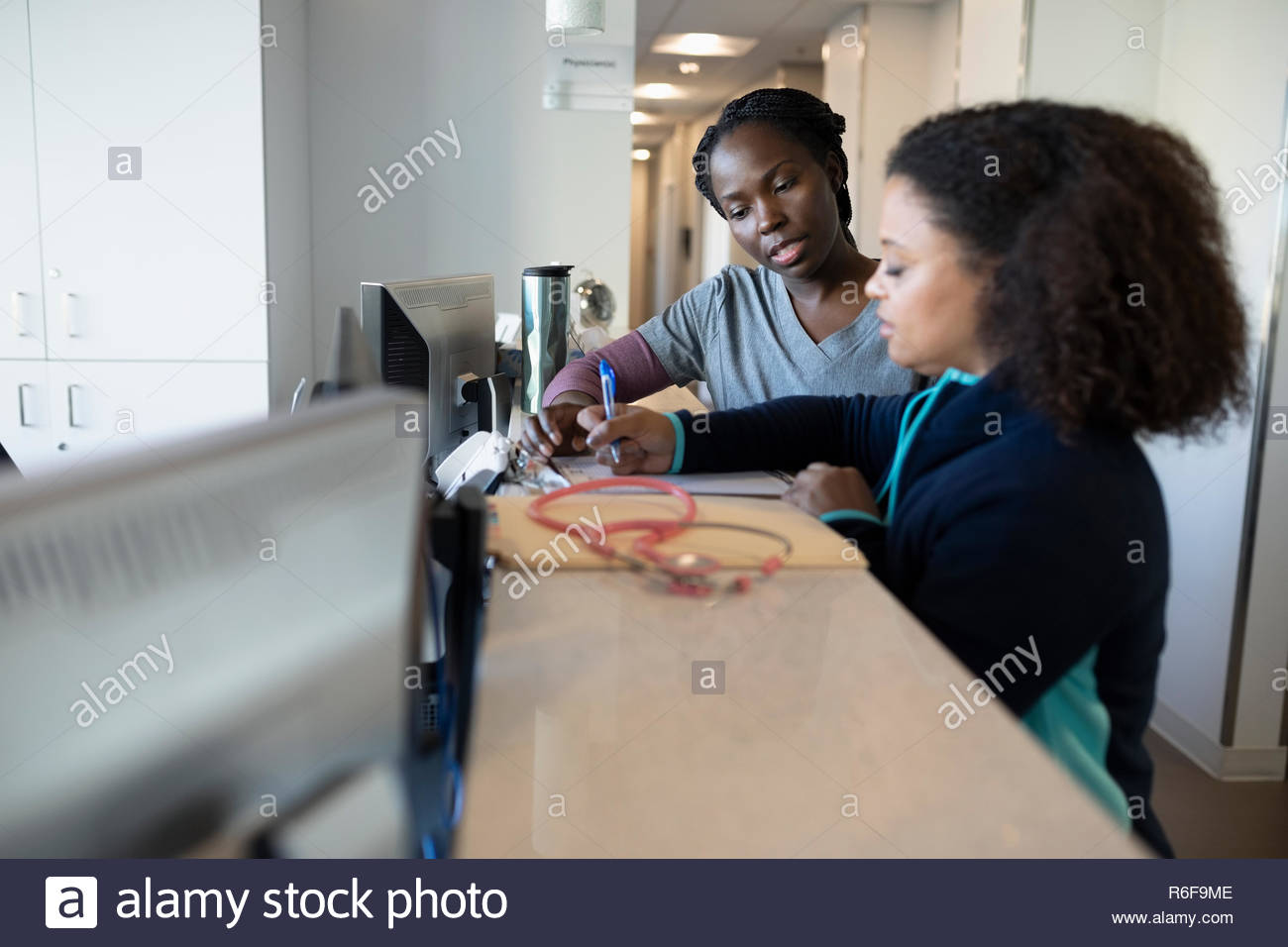 Two nurses standing hi-res stock photography and images - Alamy