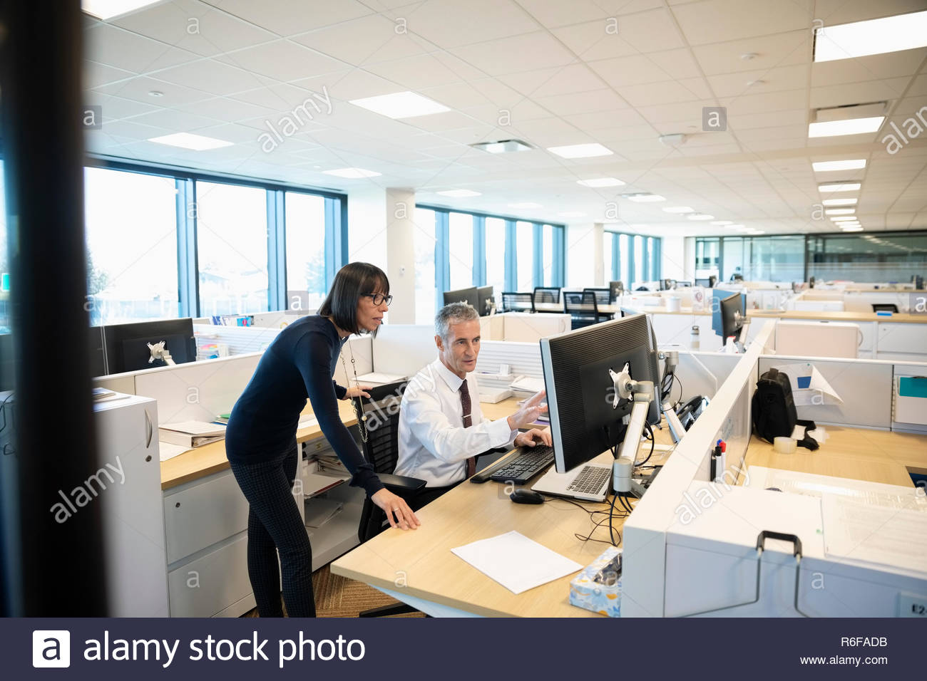 Business people working at computer in office cubicle Stock Photo - Alamy